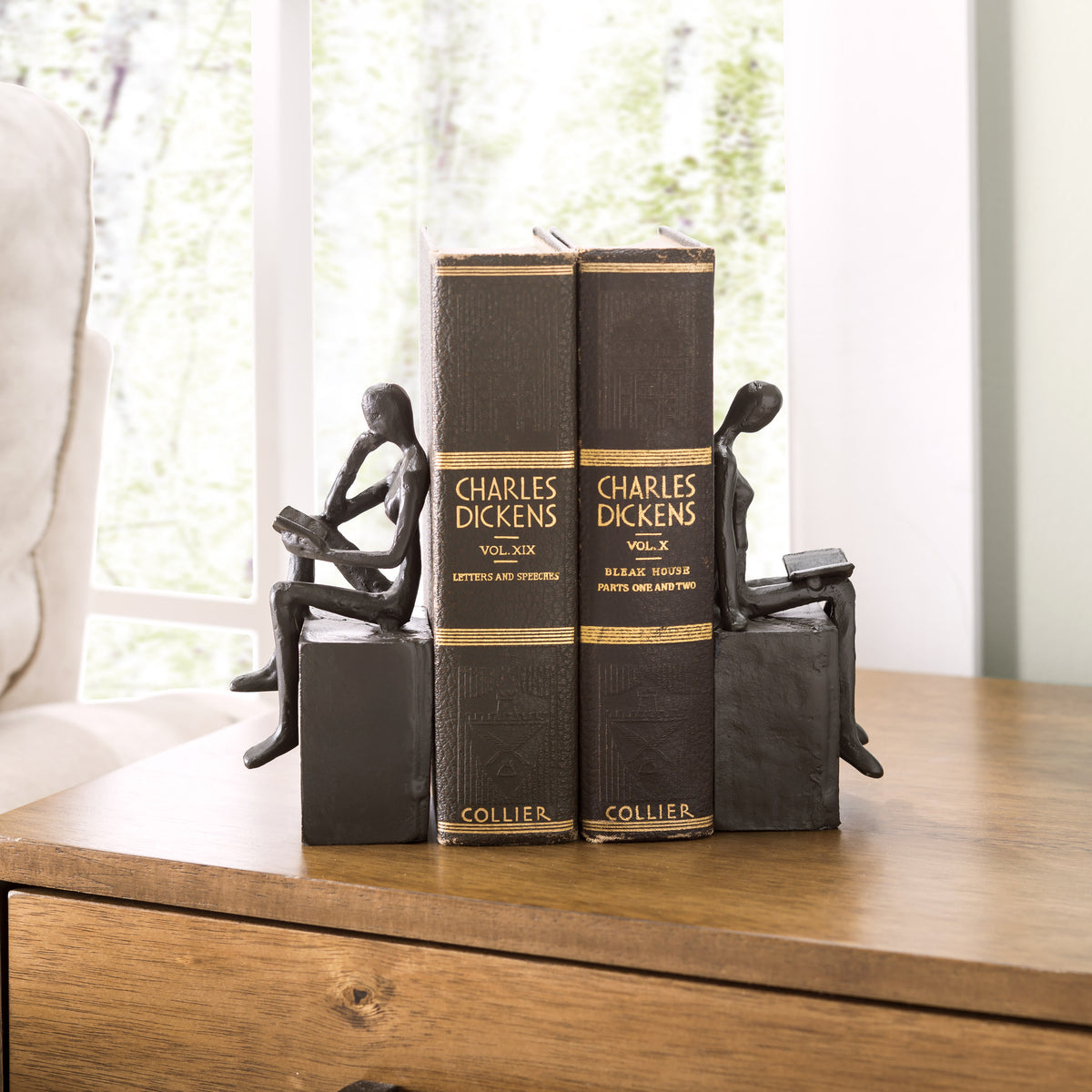 Man and Woman Reading on a Block Cast Iron Bookend Set – Danya B.